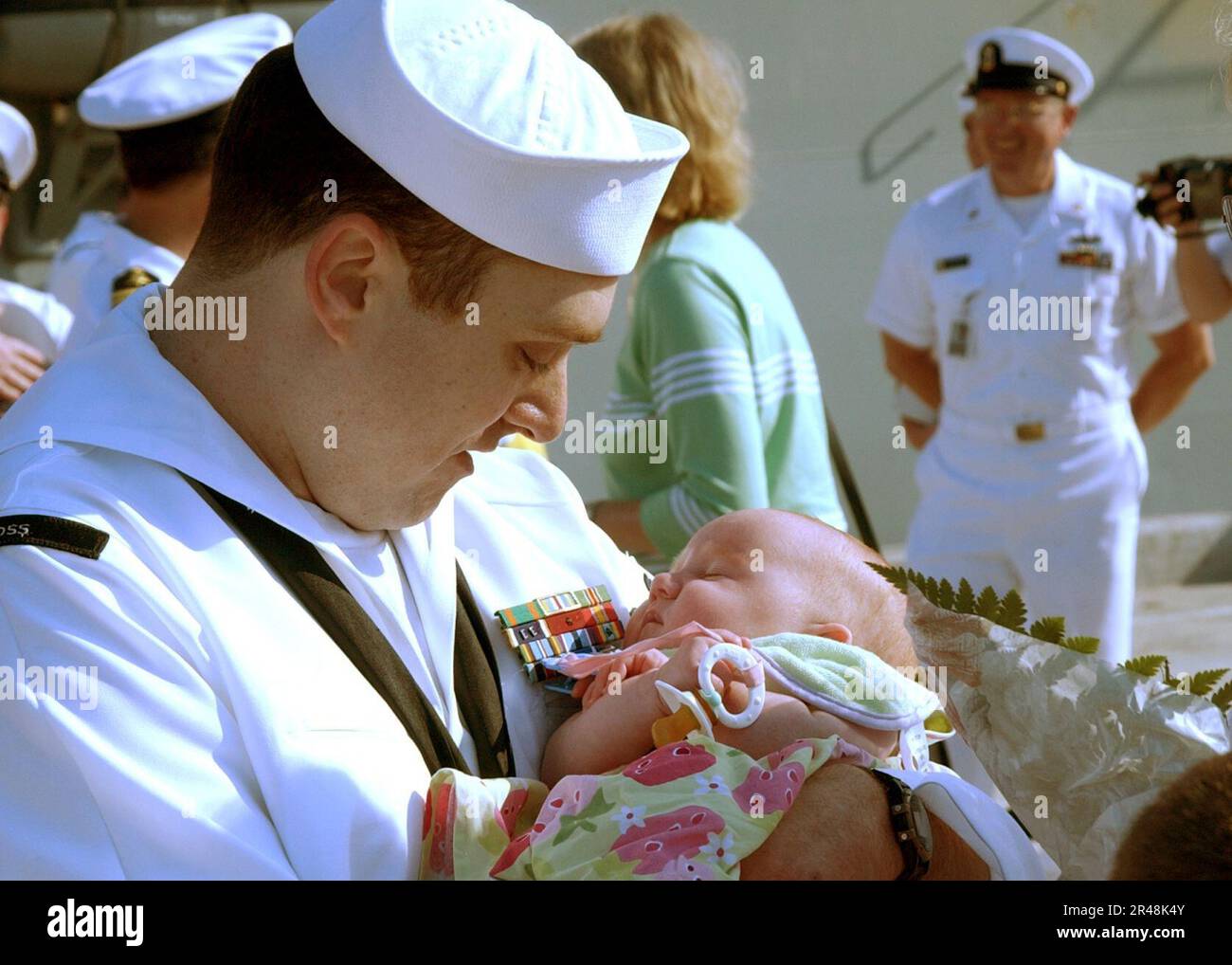 US Navy Sailor meets daughter for the first time Stock Photo - Alamy
