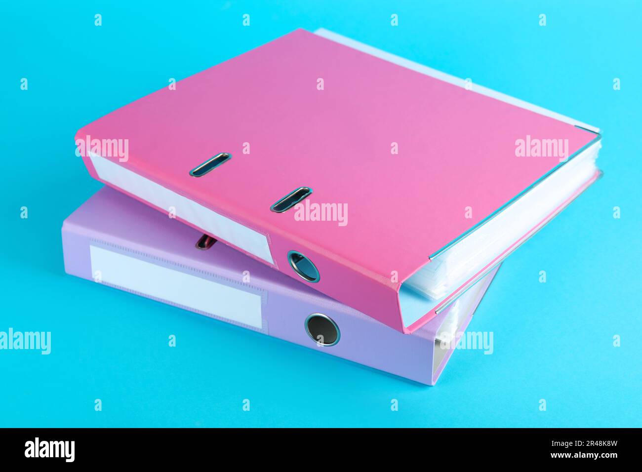 Hardcover office folders on light blue background Stock Photo - Alamy