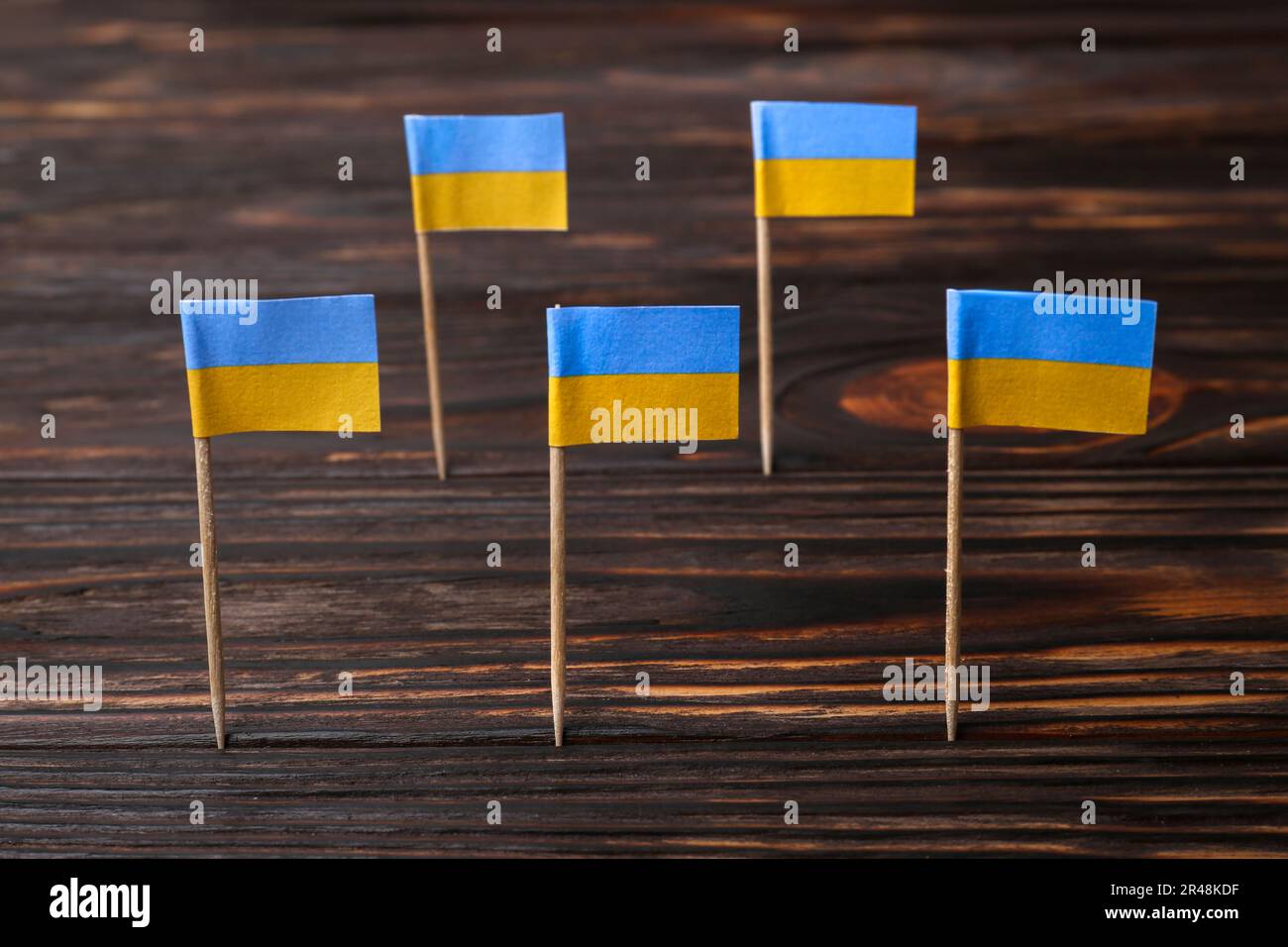 Flags and symbol on wooden pole hi-res stock photography and images - Alamy
