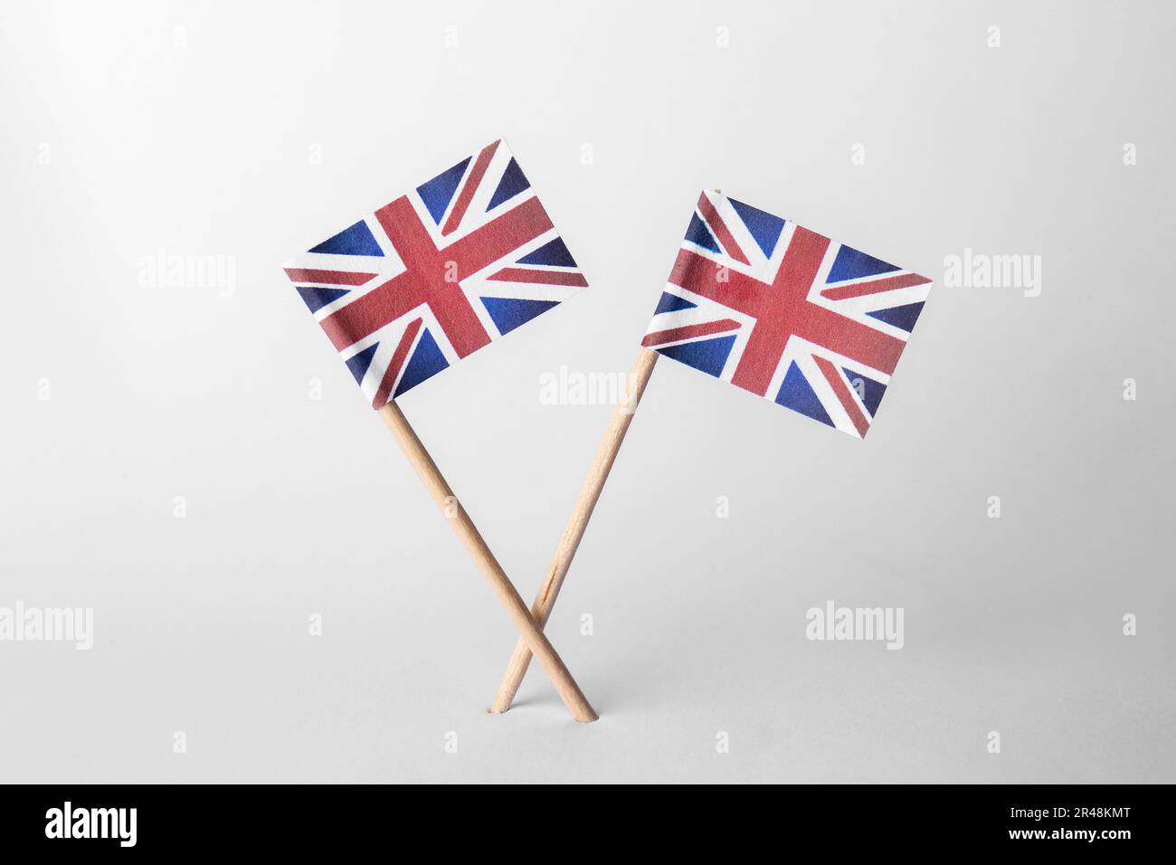 Small paper flags of United Kingdom on light background Stock Photo - Alamy