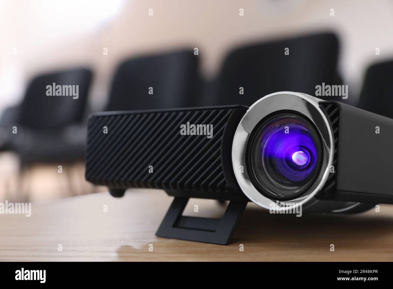 Modern video projector on table in conference room Stock Photo - Alamy