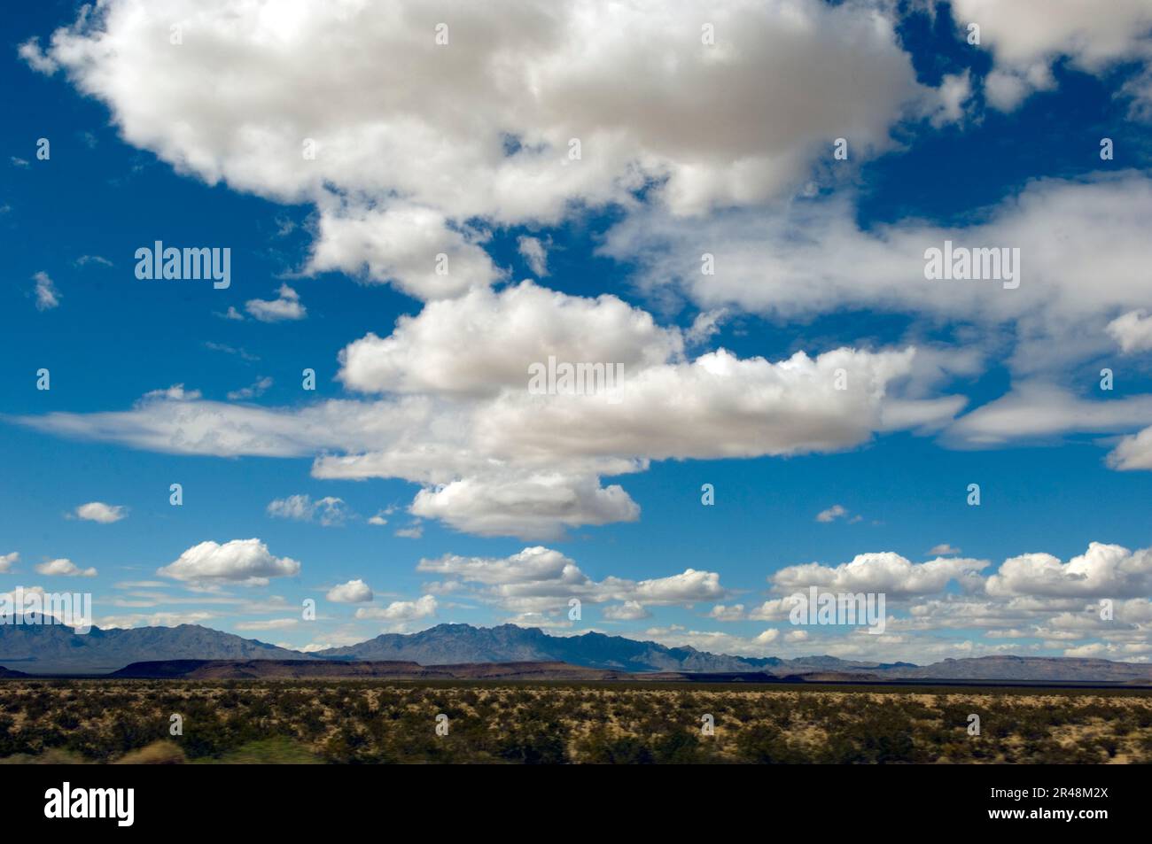 Puffy clouds and wide open spaces in western landscape near Flagstaff ...