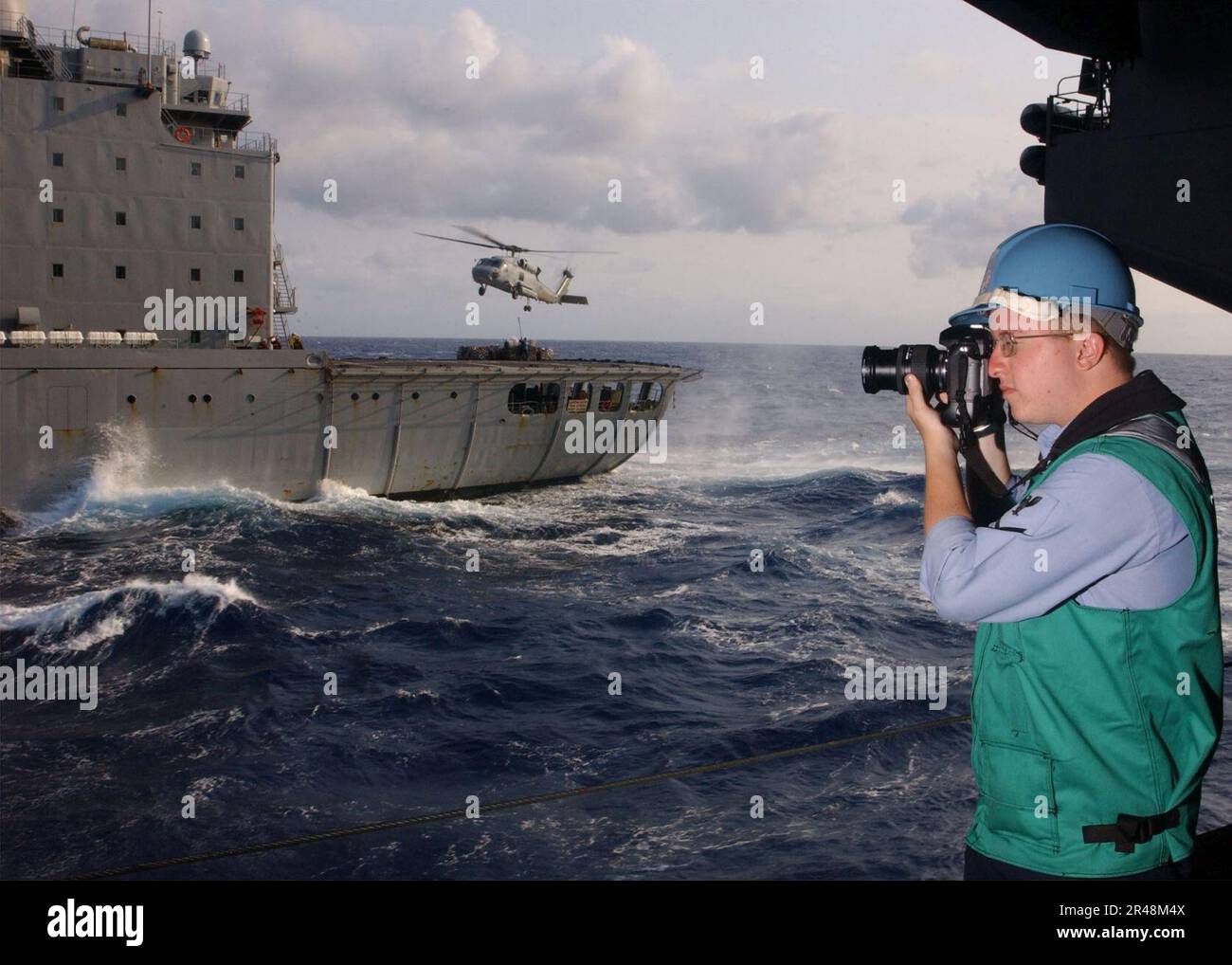 US Navy Navy Photographer documents a replenishment at sea Stock Photo ...