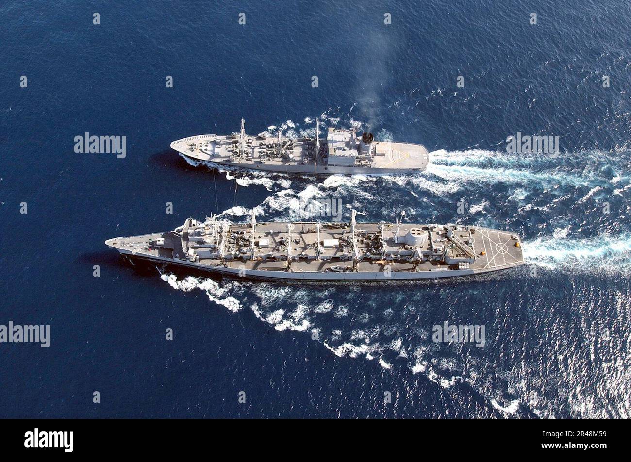 US Navy USS Seattle - unrep with Japanese oiler Stock Photo - Alamy