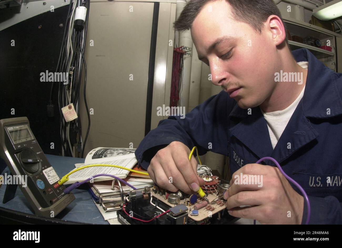 US Navy USS Kitty Hawk - troubleshooting a circuit card Stock Photo - Alamy