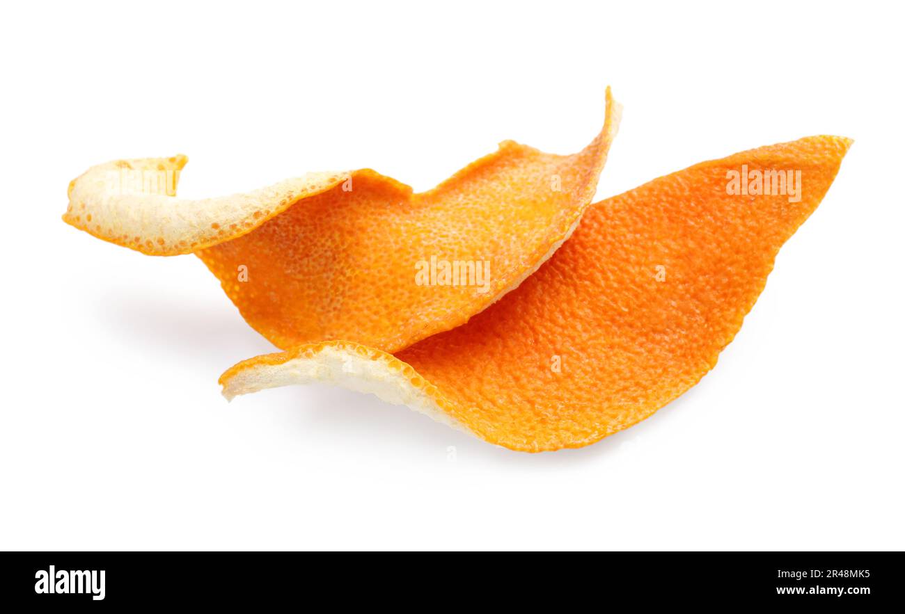 Dry orange fruit peels on white background Stock Photo - Alamy