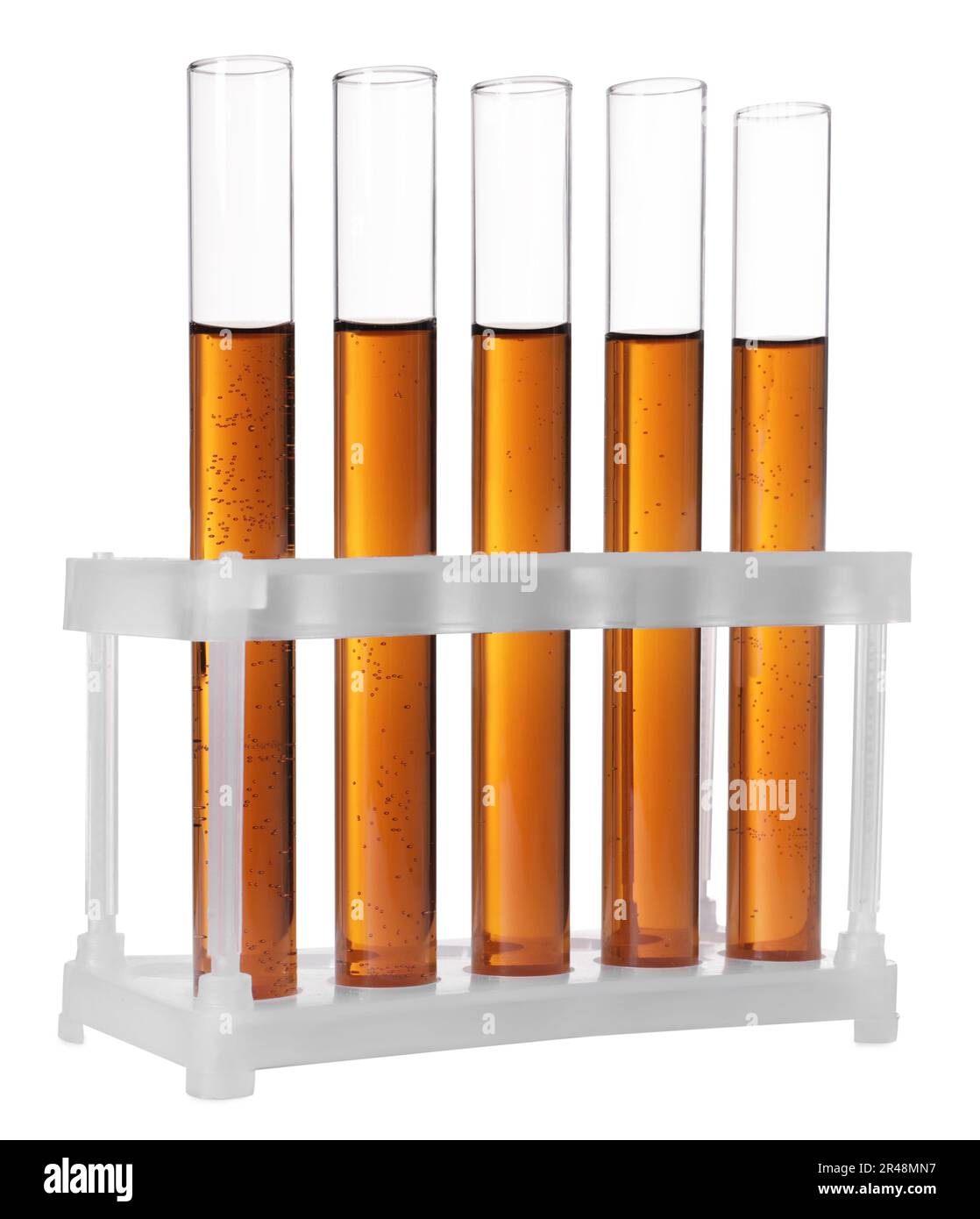 Test tubes with brown liquid in stand on white background Stock Photo ...