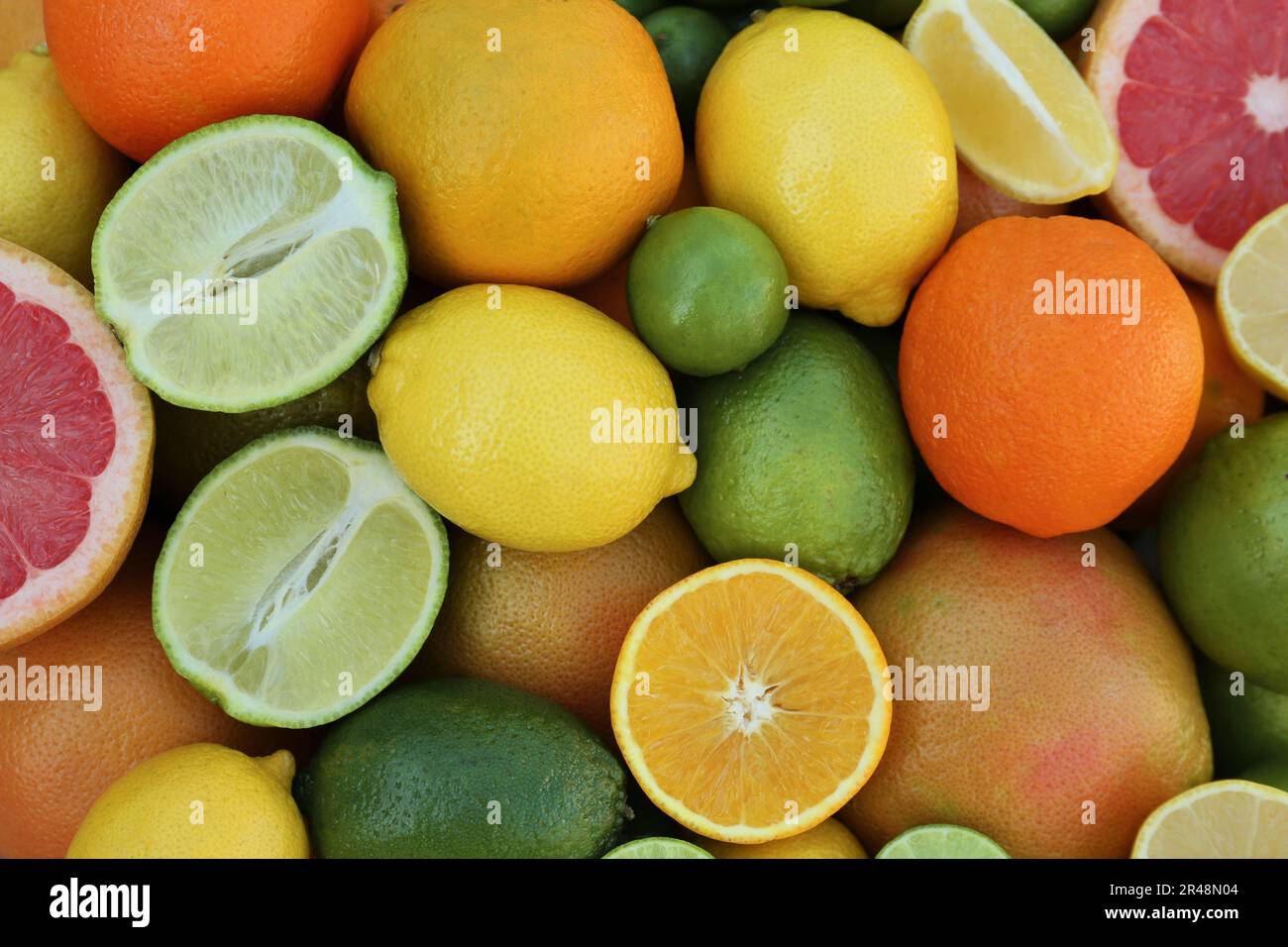 Different fresh citrus fruits as background, top view Stock Photo - Alamy