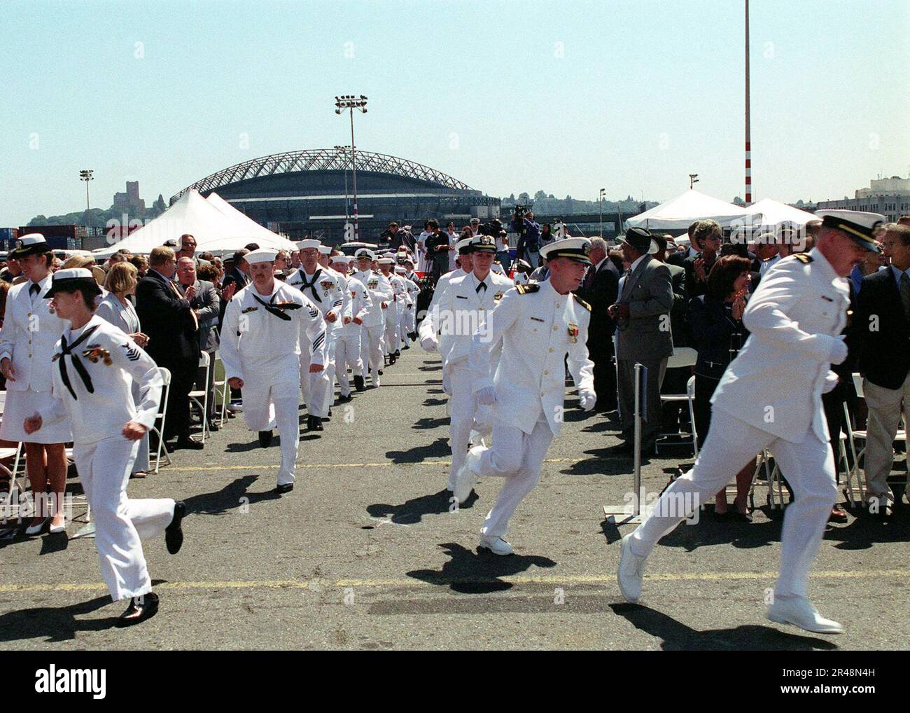 US Navy Sailors stationed aboard USS Shoup run to ''man the rails ...