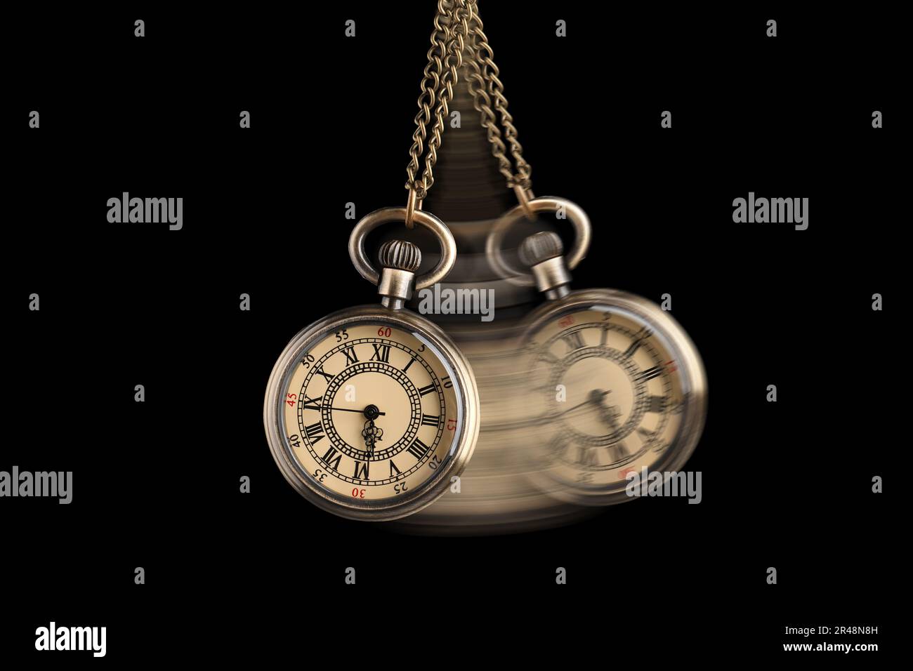 Hypnosis session. Vintage pocket watch with chain swinging on black ...