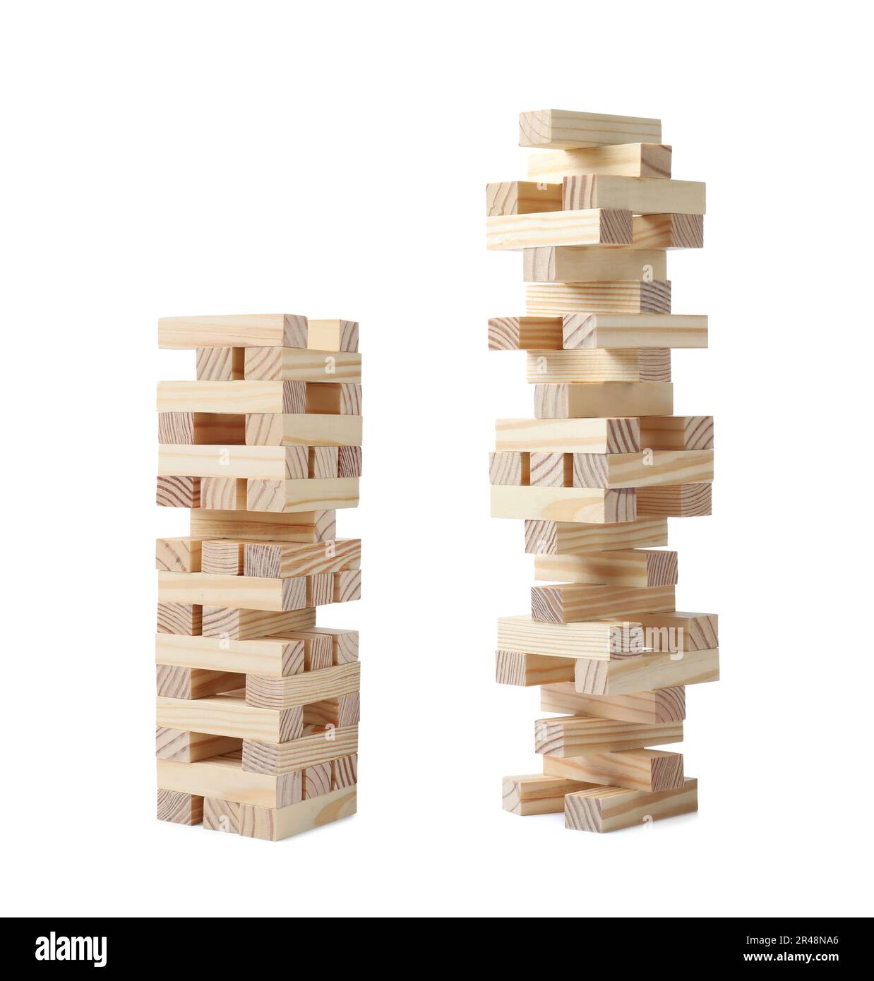 Jenga towers of wooden blocks on white background Stock Photo - Alamy