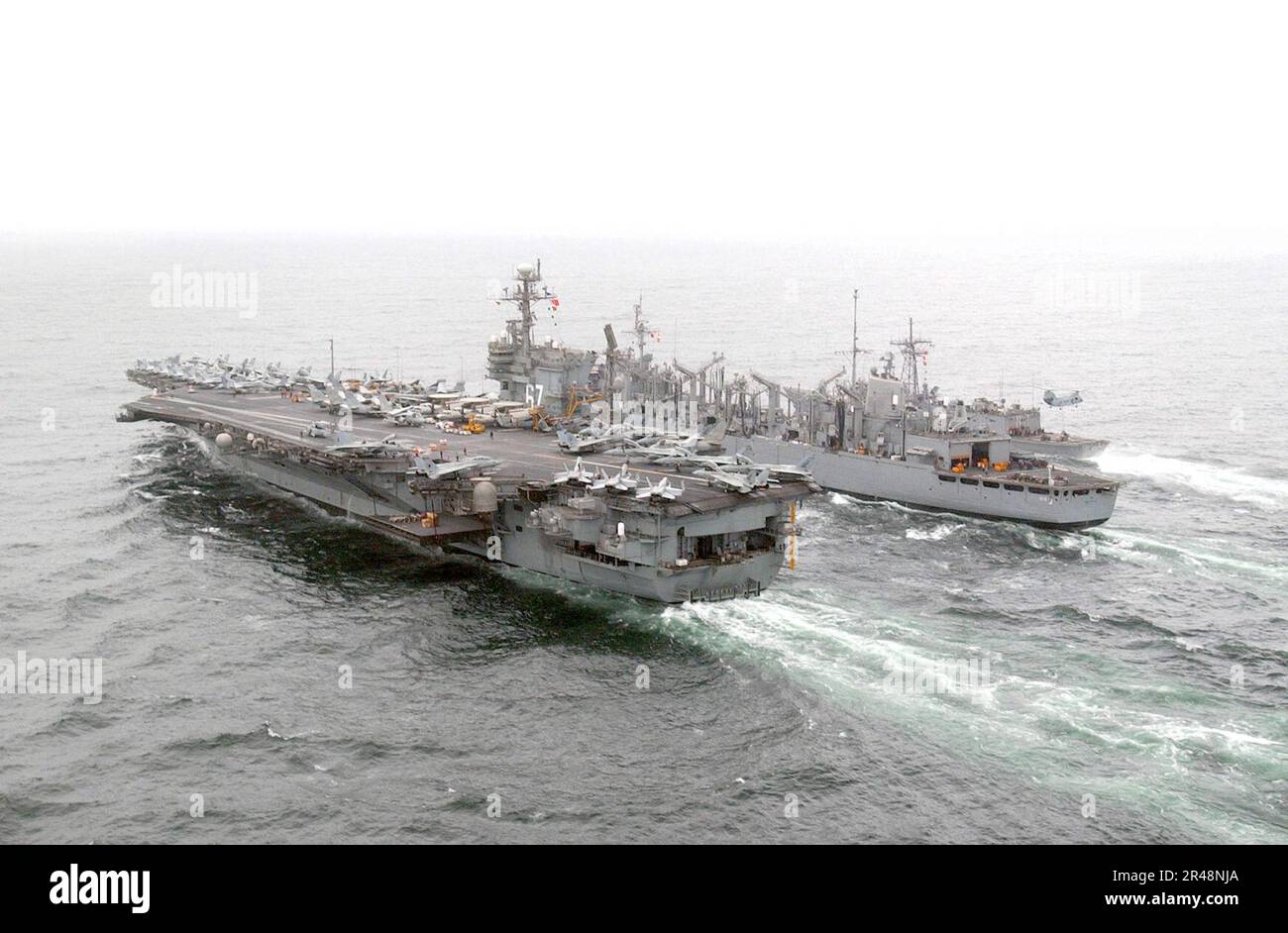 US Navy U.S. Navy ships conducting a replenishment at sea operation ...