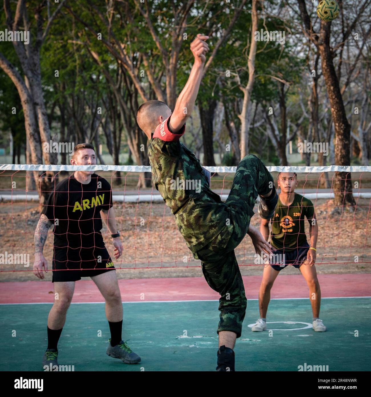 A Royal Thai Army Soldier kicks a rattan ball to U.S. Army Sgt. Malachi ...