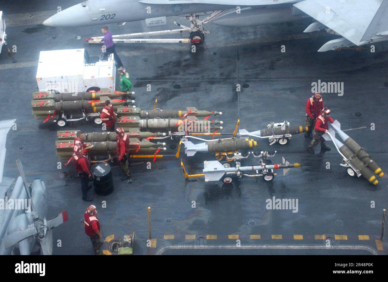 US Navy Ordnance movement on flight deck Stock Photo - Alamy