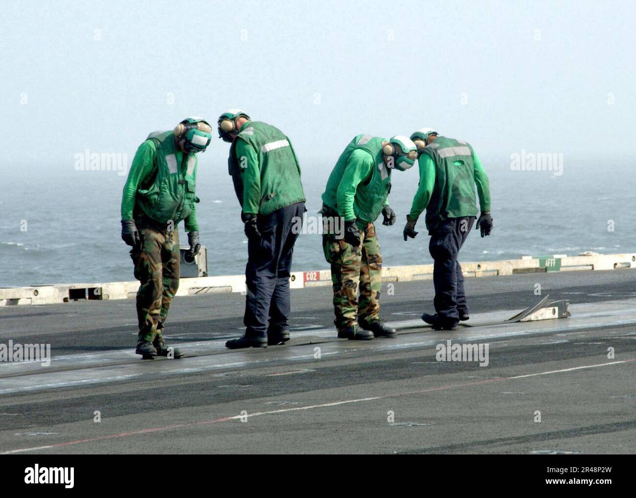 US Navy Catapult maintenance aboard CVN 73 Stock Photo - Alamy