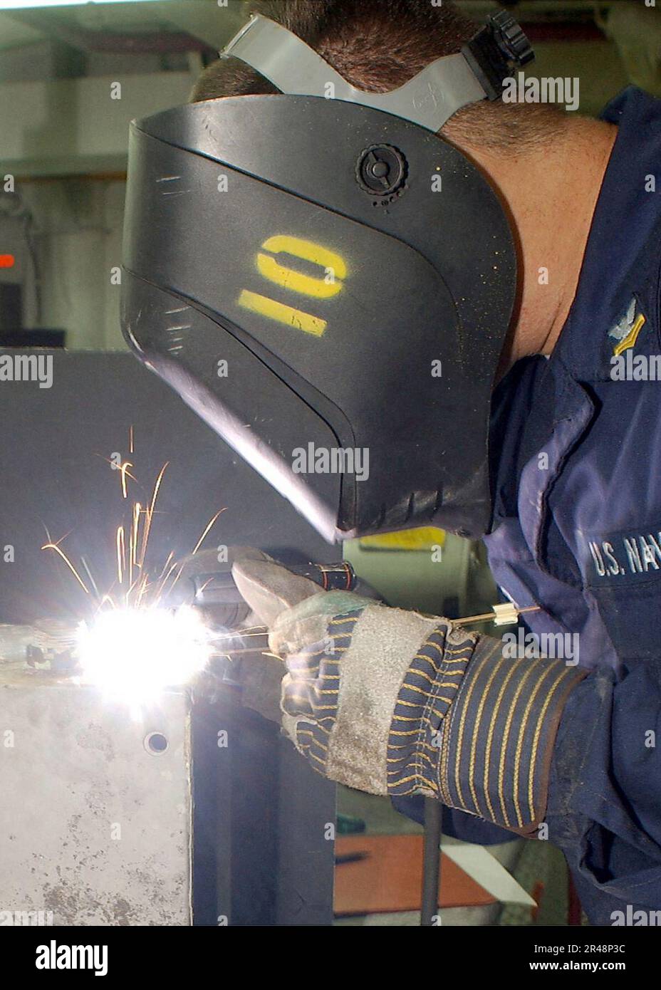 US Navy Welder works aboard ship Stock Photo - Alamy