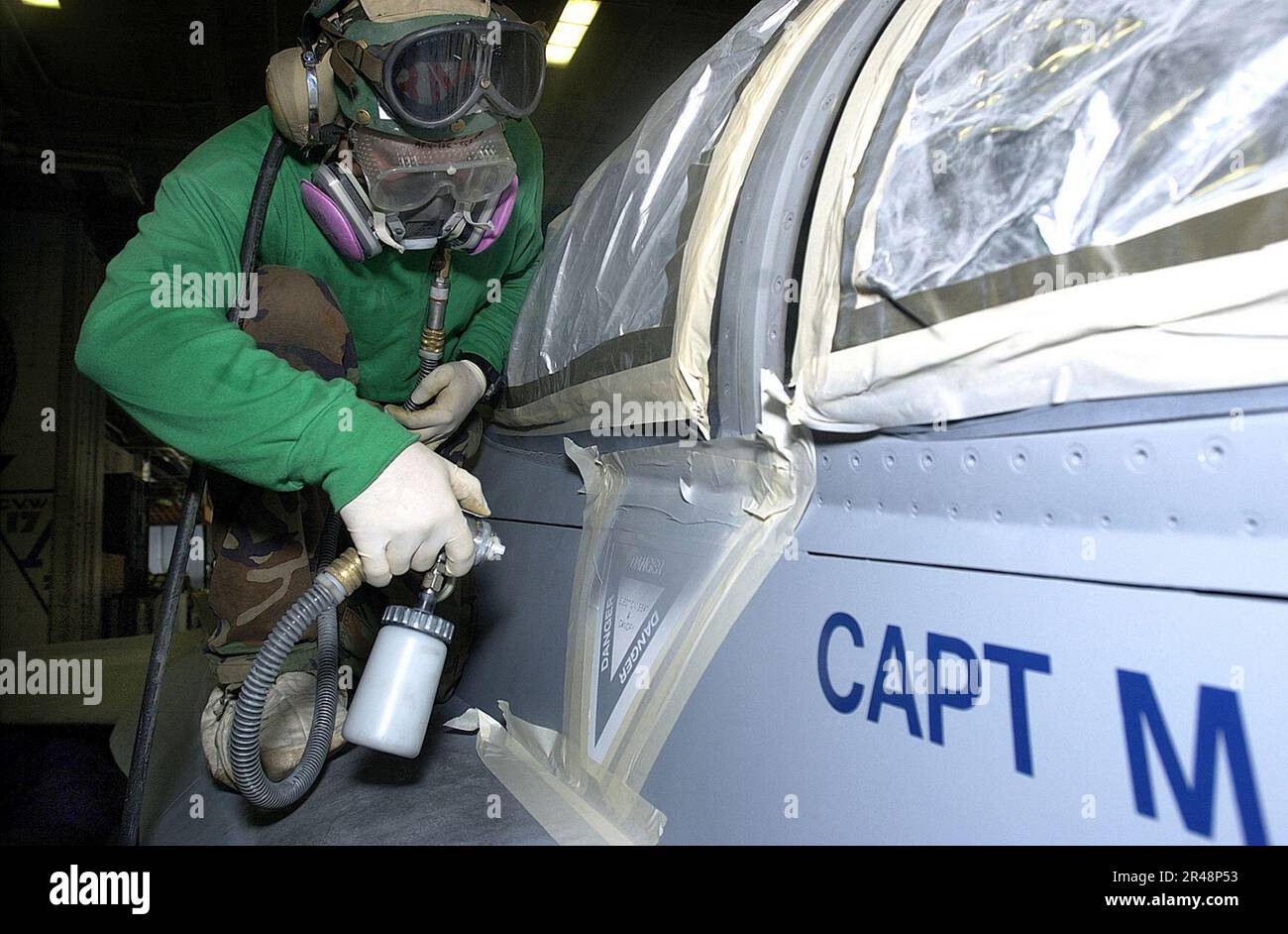 US Navy Aircraft painting and maintenance aboard ship Stock Photo - Alamy