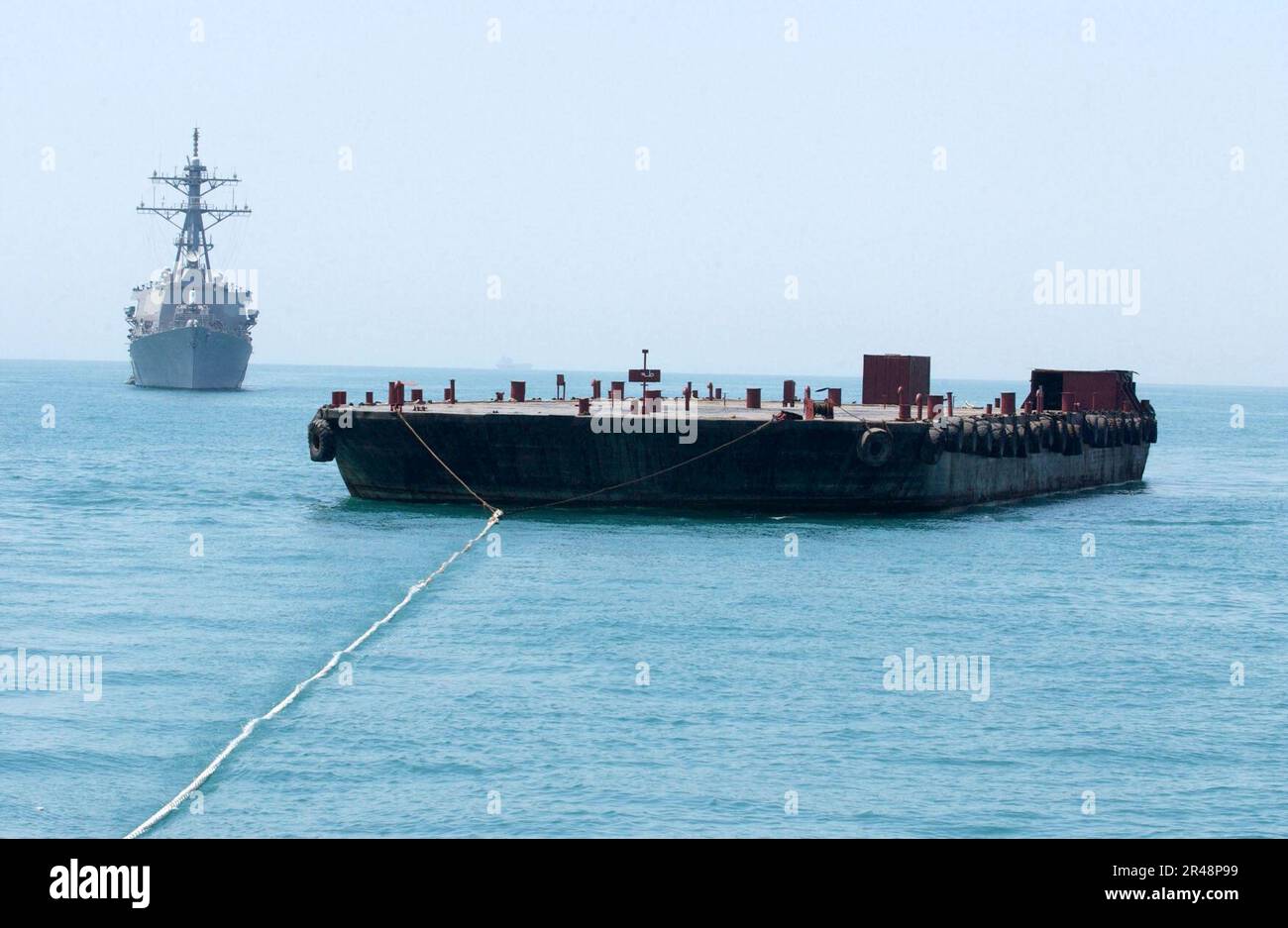 US Navy A tug pulling oil barges suspected of smuggling illegal oil out ...