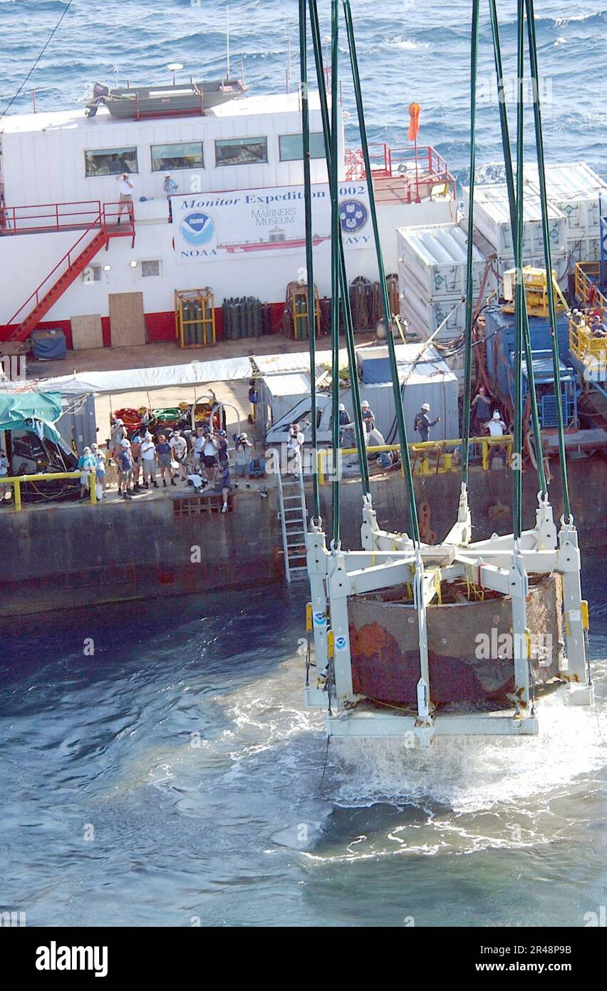 US Navy USS Monitor gun turret pulled from the water during salvage ...