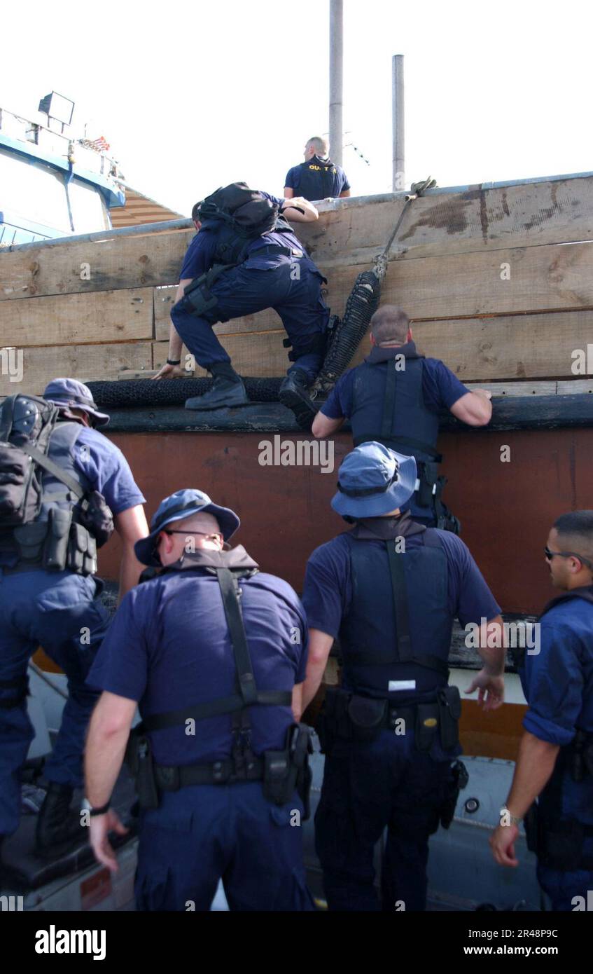 US Navy USS Hopper boarding team inspects a possible Iraqi oil smuggler ...