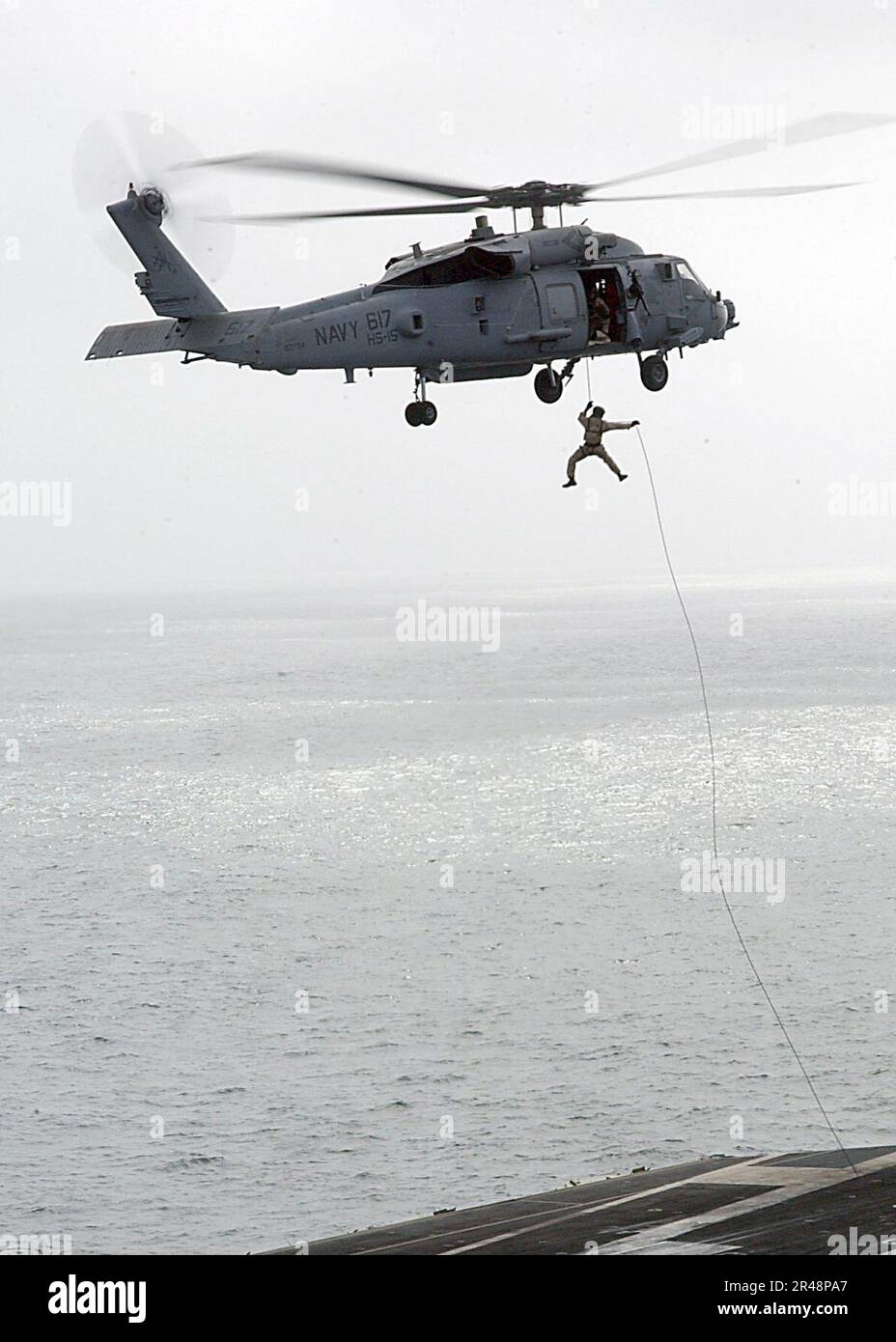 US Navy EOD Team Member repels from an SH-60 Stock Photo - Alamy