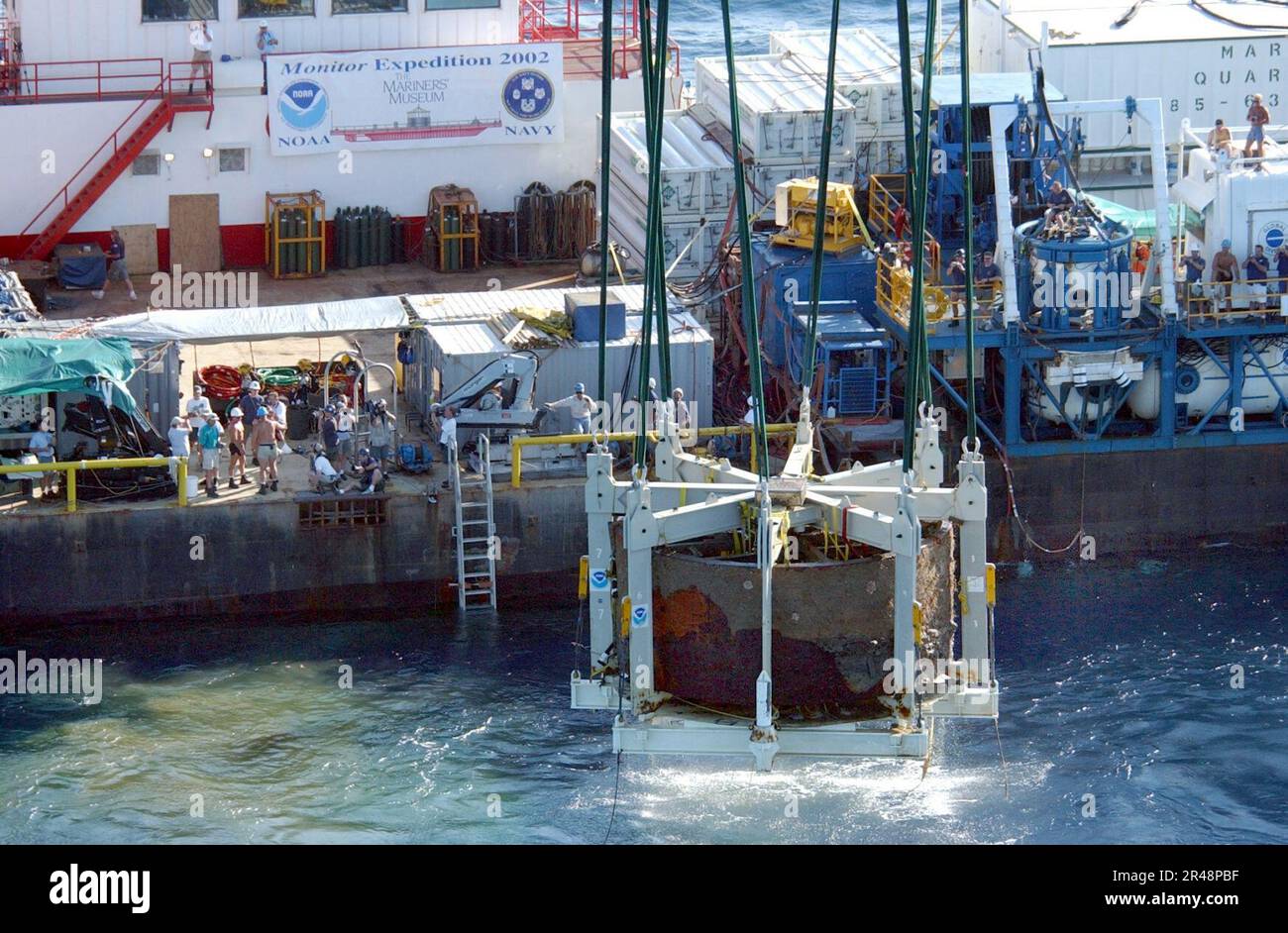 US Navy USS Monitor gun turret pulled from the water during salvage ...