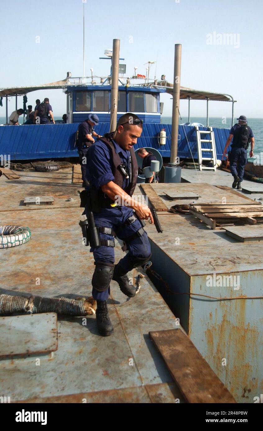US Navy USS Hopper boarding team inspects a suspected Iraqi oil ...