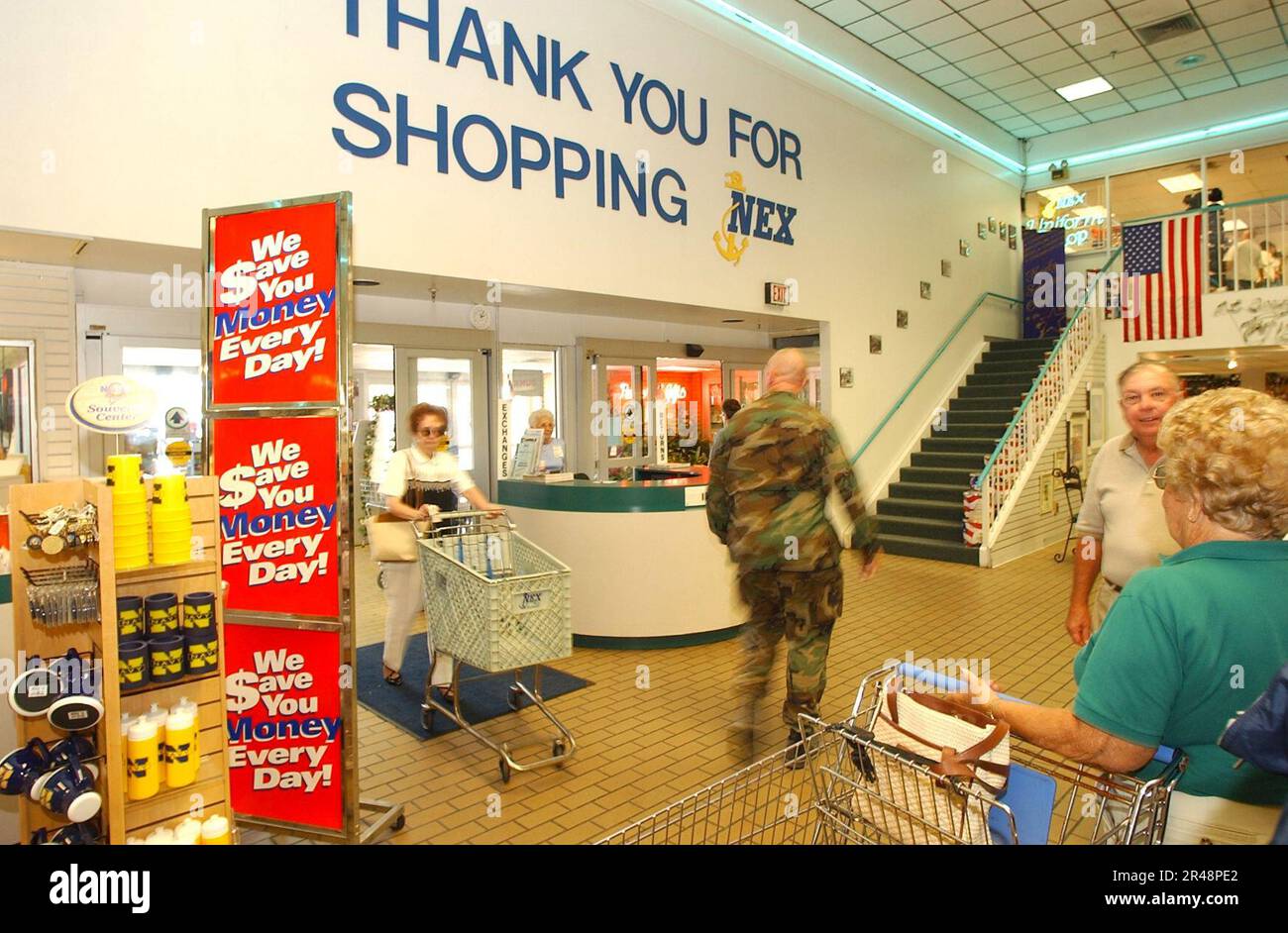 US Navy Shoppers shop inside the mall section of the Navy Exchange ...