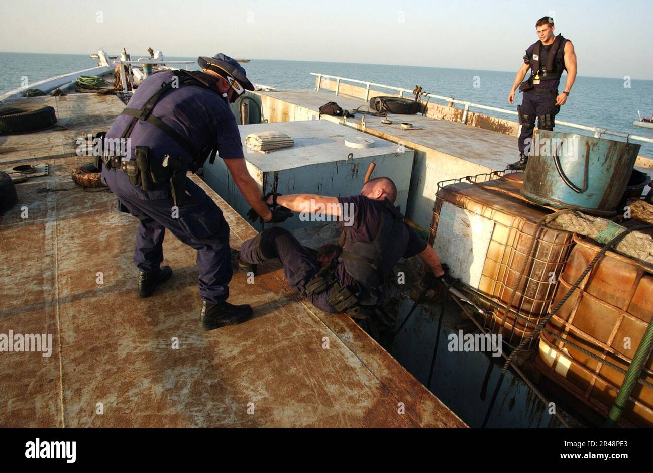 US Navy LEDET Team inspect Iragi cargo boat for smuggling oil Stock ...