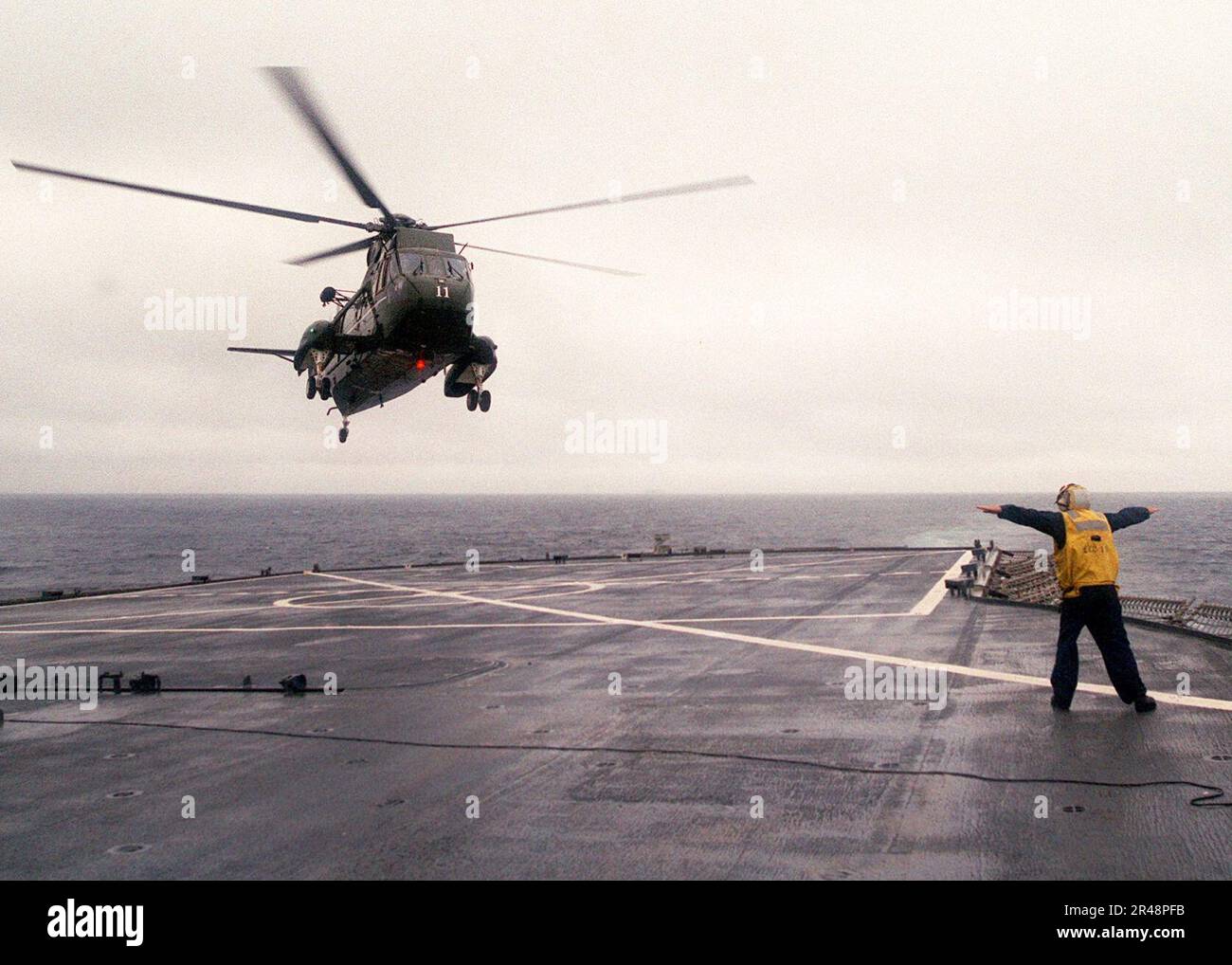 US Navy A UH-3H ''Sea King'' helicopter approaches the flight deck aboard USS Blue Ridge Stock ...
