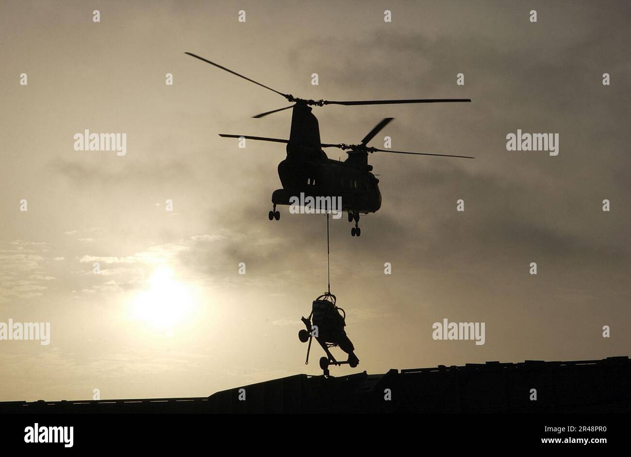 US Navy CH-46 lifts an aircraft engine off the flight deck of USS ...