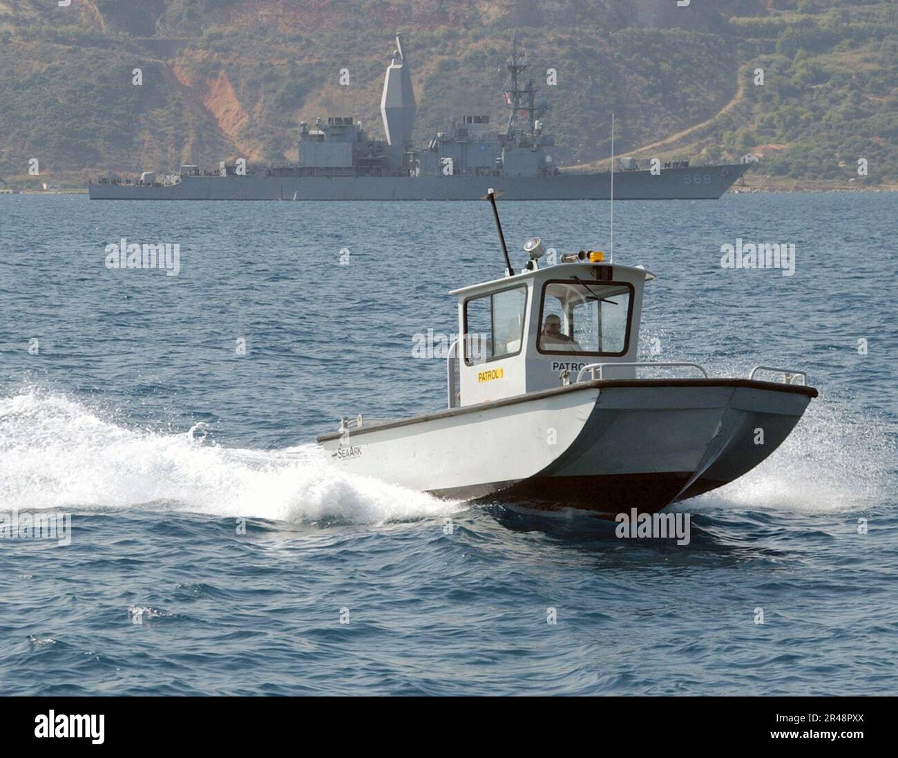 US Navy A Naval Support Activity patrol boat keeps watch over harbor ...