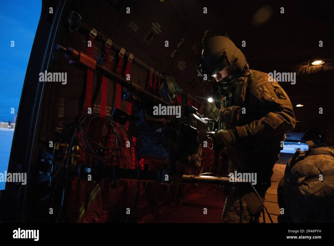 U.S. Army Staff Sgt. Tyler Brewer, a CH-47F Chinook crew chief with ...