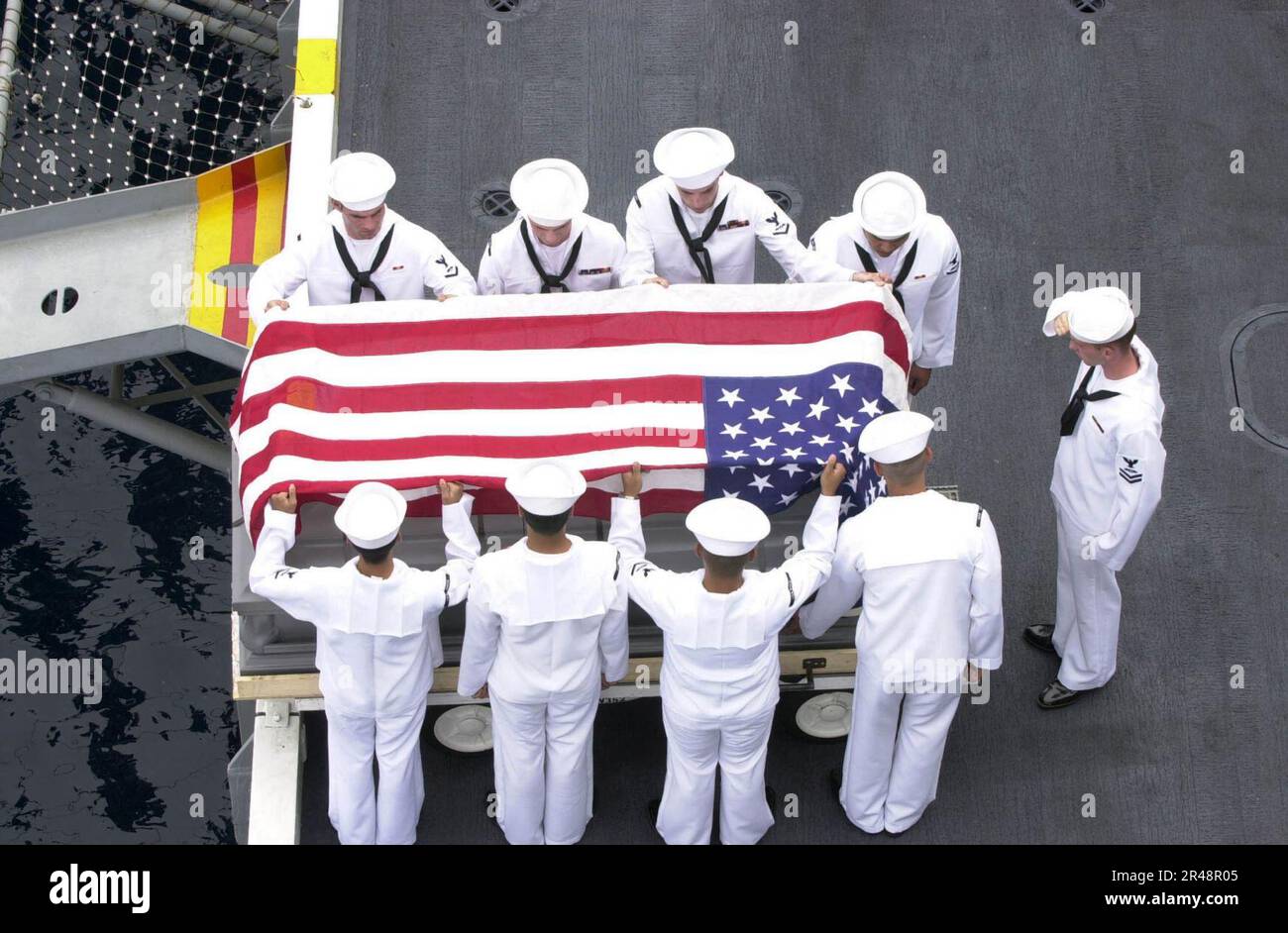 US Navy A burial at sea detail commends the remains of a shipmate to ...