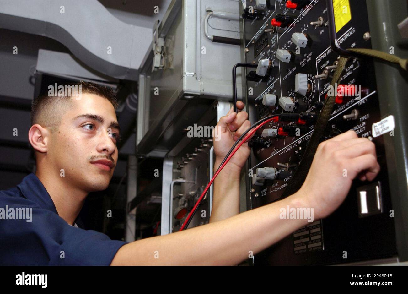 US Navy Aviation Electrician conducts a temperature controller test set ...