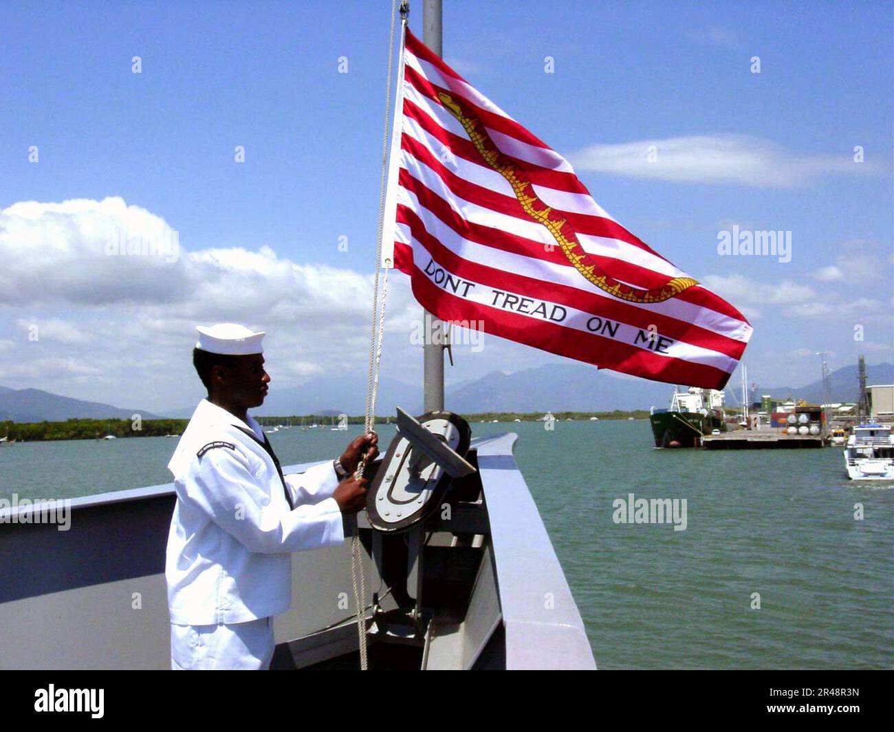 US Navy Raising the Navy Jack aboard ship Stock Photo - Alamy