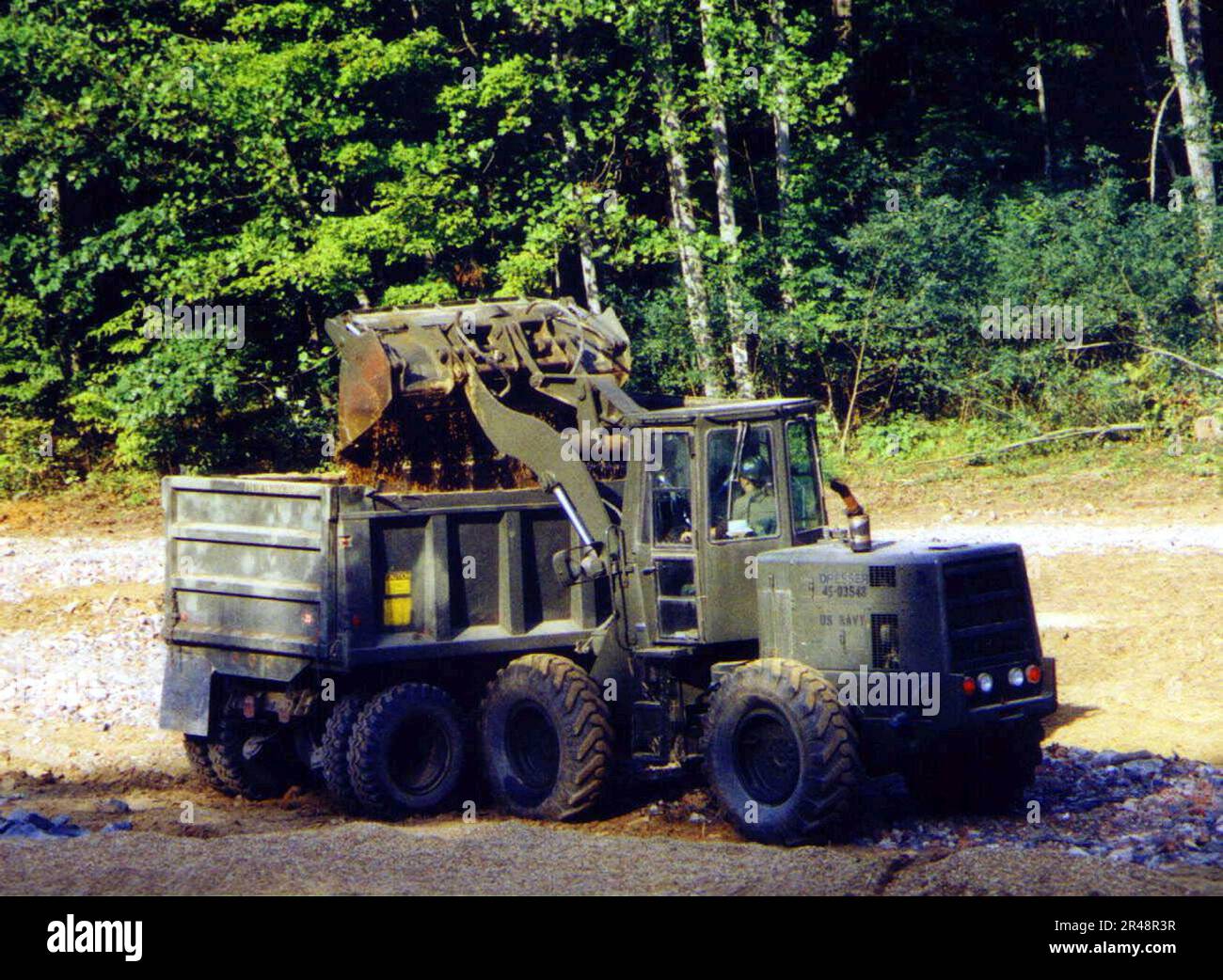 US Navy An equipment perator assigned to Naval Mobile Construction ...