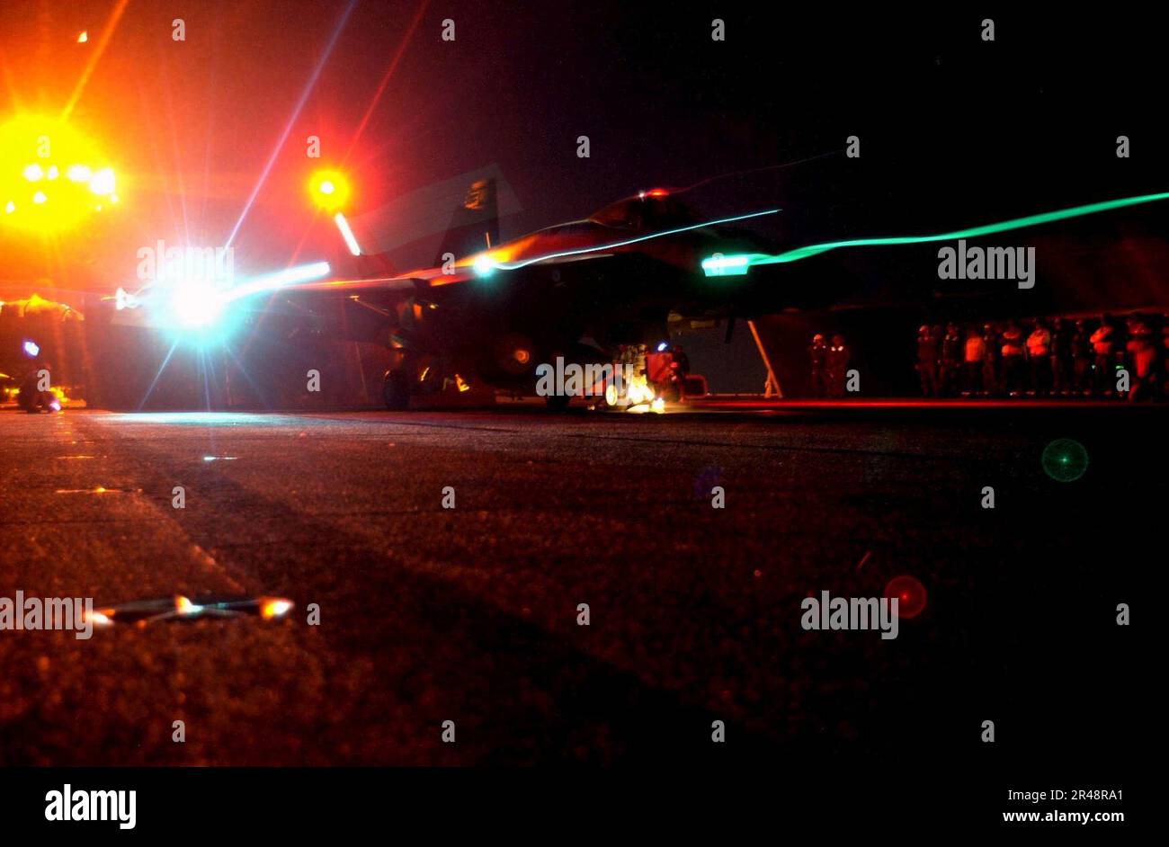 US Navy F-A-18 Hornet makes night launch from USS Nimitz Stock Photo ...