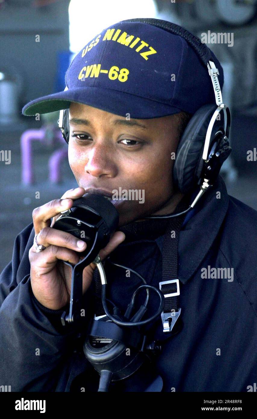 US Navy Aft Look out communicates on sound-powered phone with the ship ...