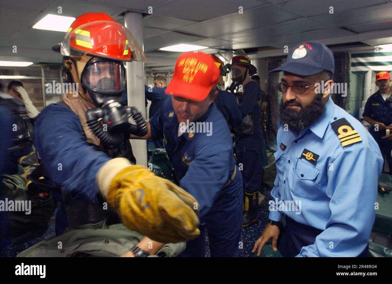 US Navy Crewmembers aboard Rueben James give instructions on how a ...