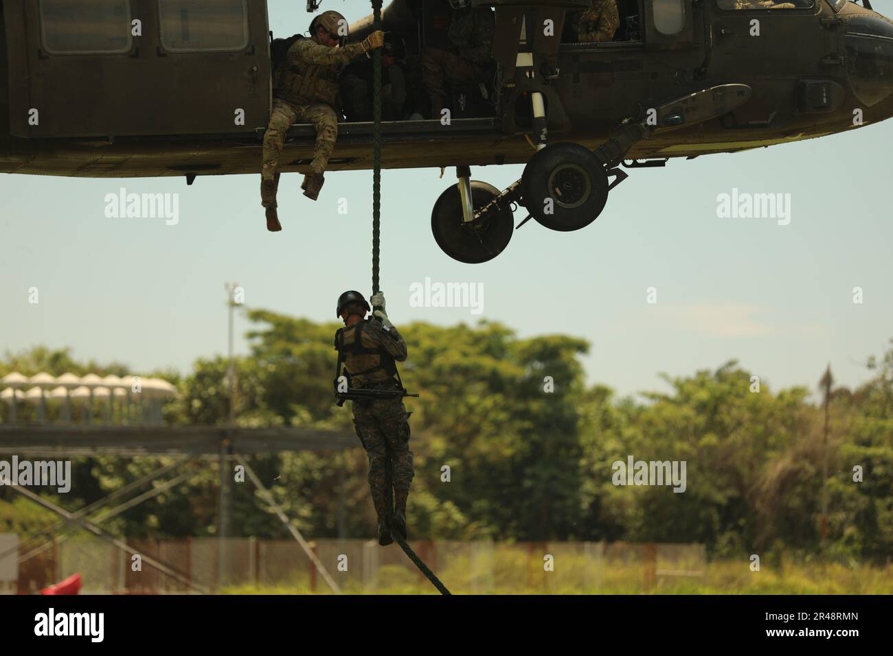 Guatemalan Naval Special Forces fast rope from a UH60 Blackhawk for ...