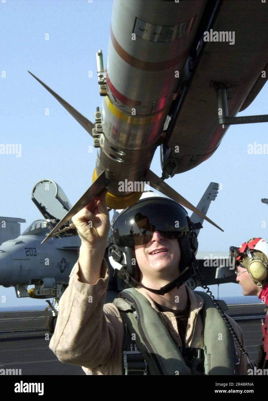 US Navy Pilot checks an AIM-7 ''Sea Sparrow'' missile on his aircraft ...