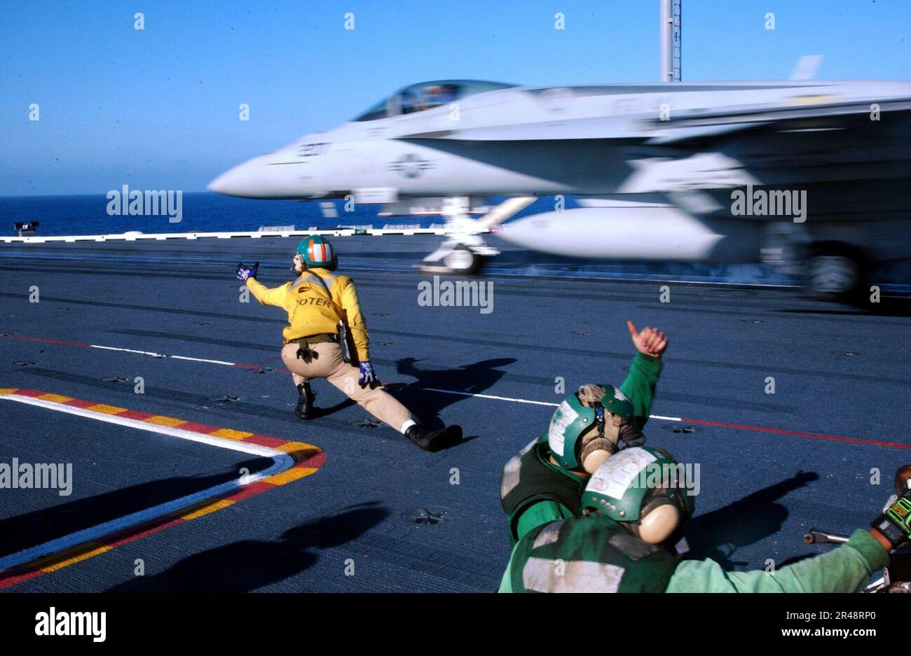 US Navy A 'Shooter' signals for launch of an F-A-18E ''Super Hornet ...