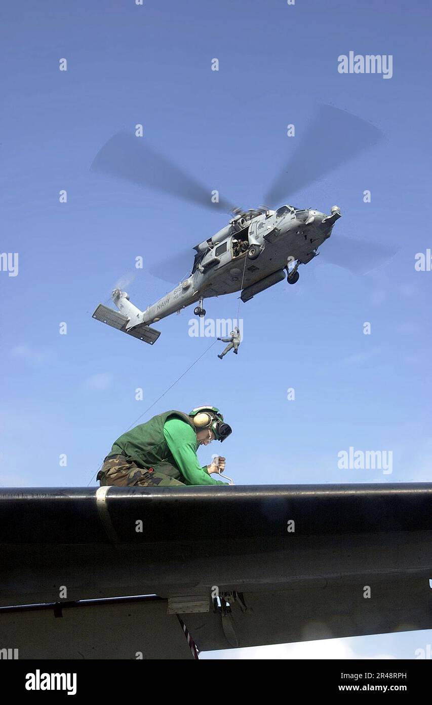 US Navy A Sailor assigned to Explosive Ordnance Disposal (EOD) Team Two ...