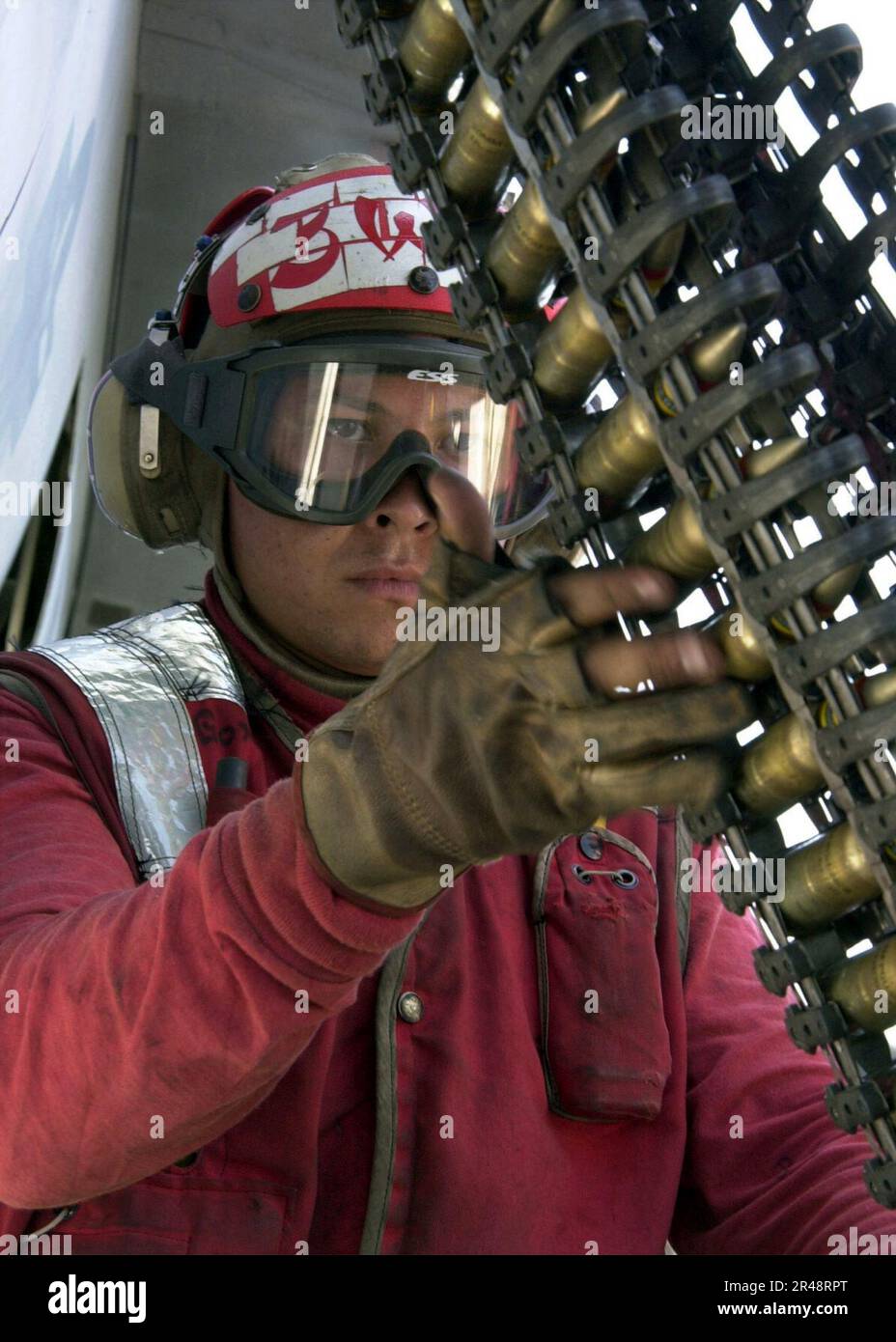 US Navy An Aviation Ordnananceman performs final checks on each 20mm ...