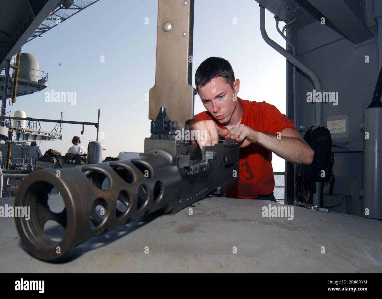 US Navy .50 caliber machine gun maintenance on board ship Stock Photo ...
