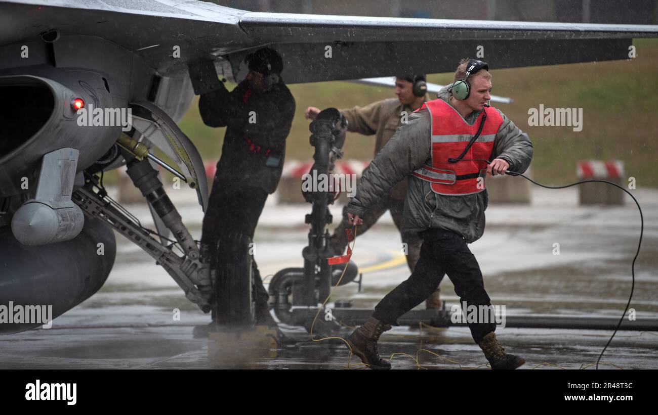 U.S. Airmen assigned to the 480th Fighter Squadron work together to ...