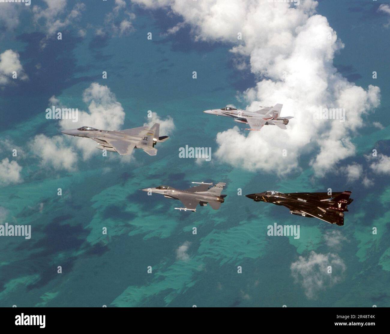 US Navy An Air Force F-15 'Eagle' and F-16 'Falcon' fly in formation ...