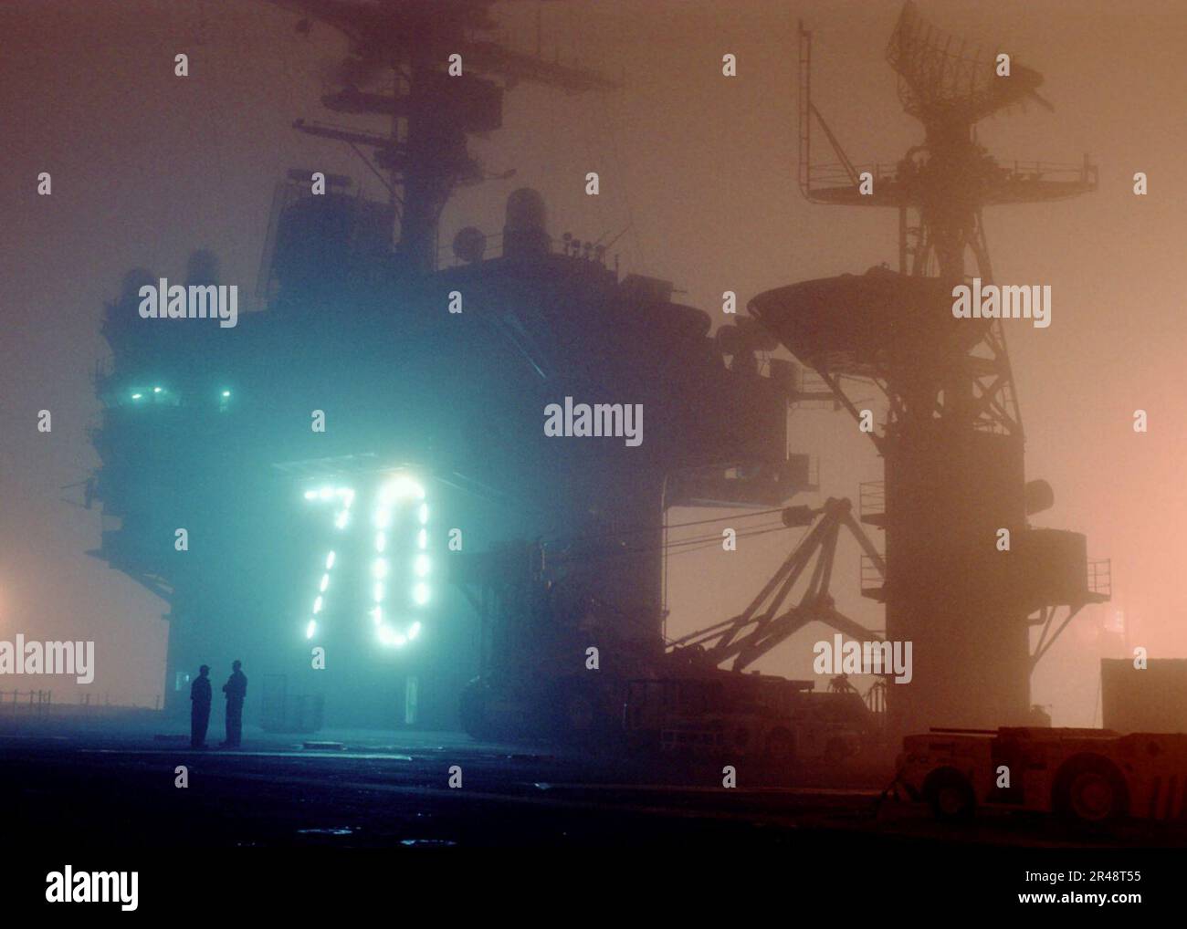 US Navy Early morning fog sets across the flight deck of the aircraft ...