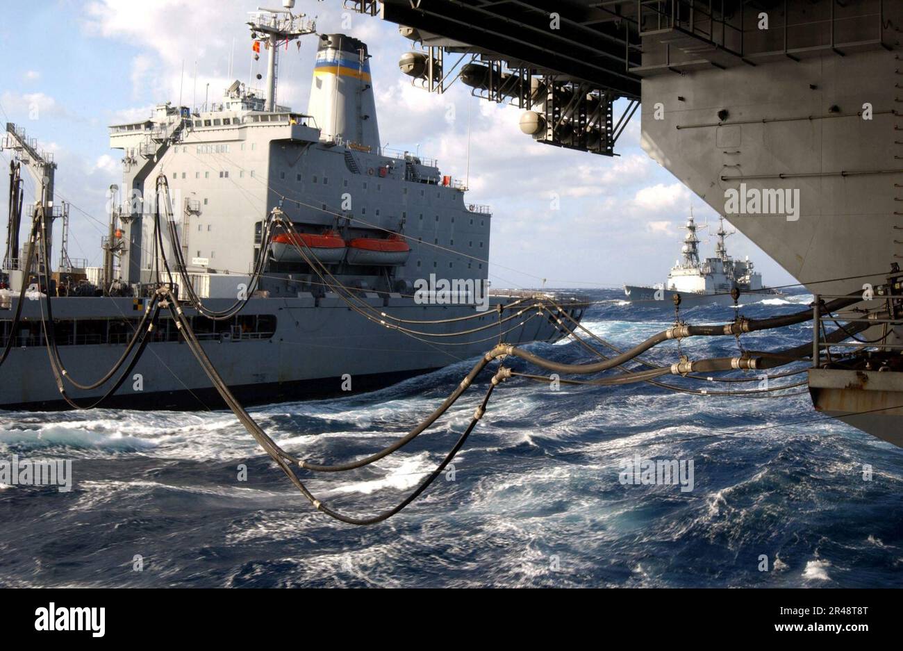 US Navy USS Kitty Hawk (CV 63) receives fuel from the Military Sealift ...